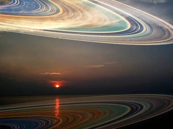 reflection of saturn ring on sea and sunset - Stock Image - Everypixel