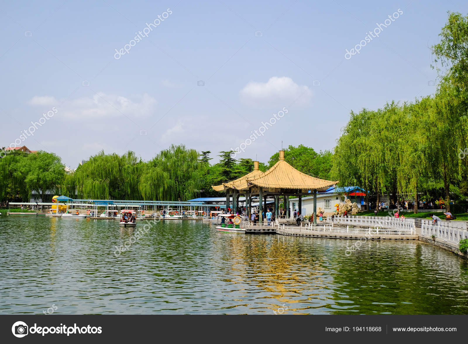 People in a park. Taoranting Park is a major city park located in ...