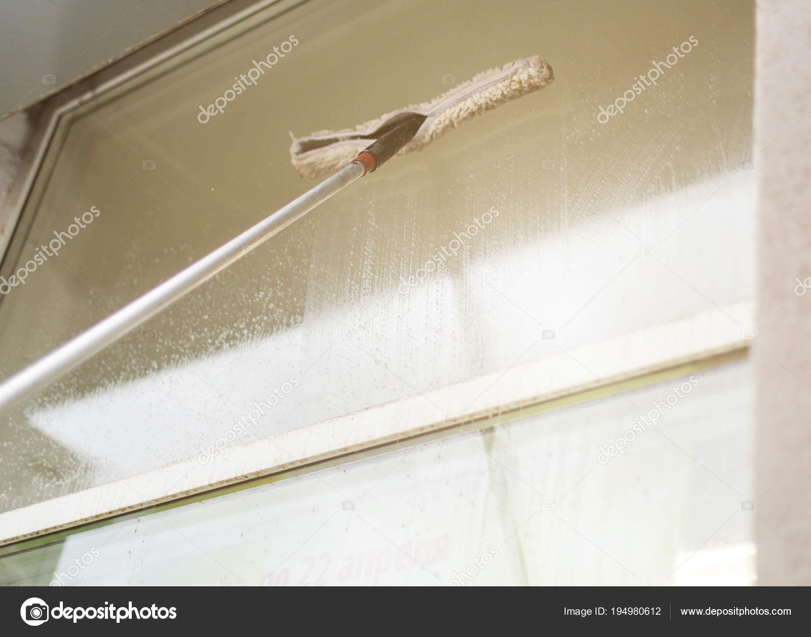 Hand washing windows with special tools and tools. Cleaning shop ...