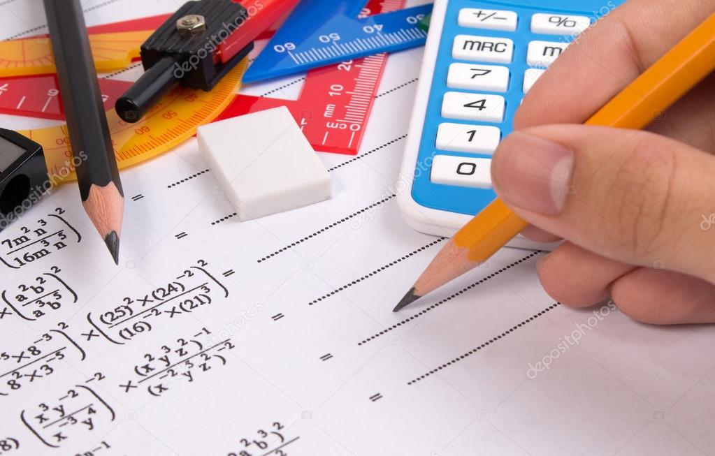 Math quadratic equation with hand holding pencil. School supplies used ... Math quadratic equation with hand holding pencil. School supplies used ...