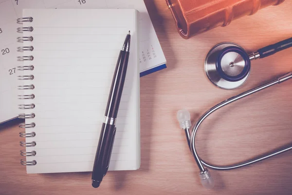 Close up of stethoscope book and pen on calendar, doctor appointment ...