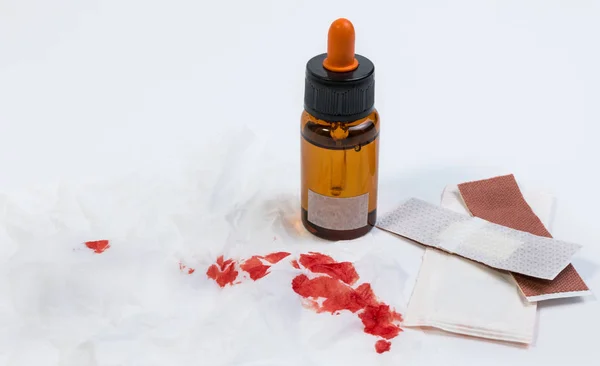 Fresh bleeding wounds or blood on tissue paper with first aid supplies ...