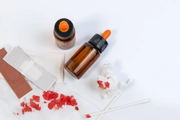 Fresh bleeding wounds or blood on tissue paper with first aid supplies ...