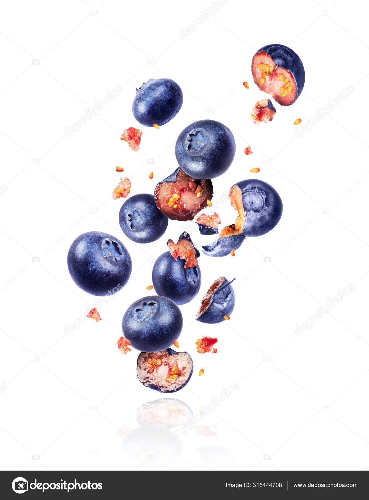 Whole and sliced fresh blueberries in the air, isolated on a white ...