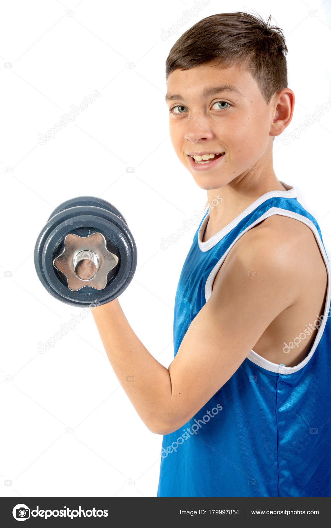 Young teenage boy using dumbbells Stock Photo by ©Triumph0828 179997854