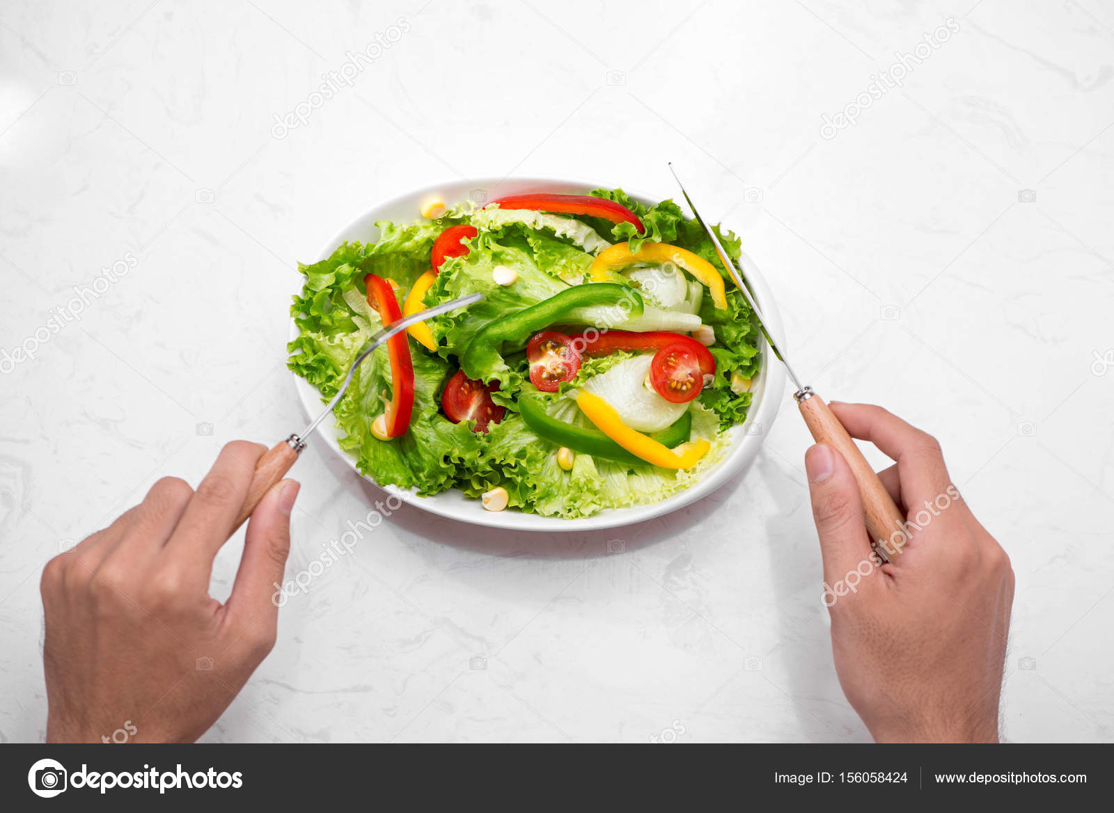 Hands holding fork and knife Stock Photo by ©makidotvn 156058424