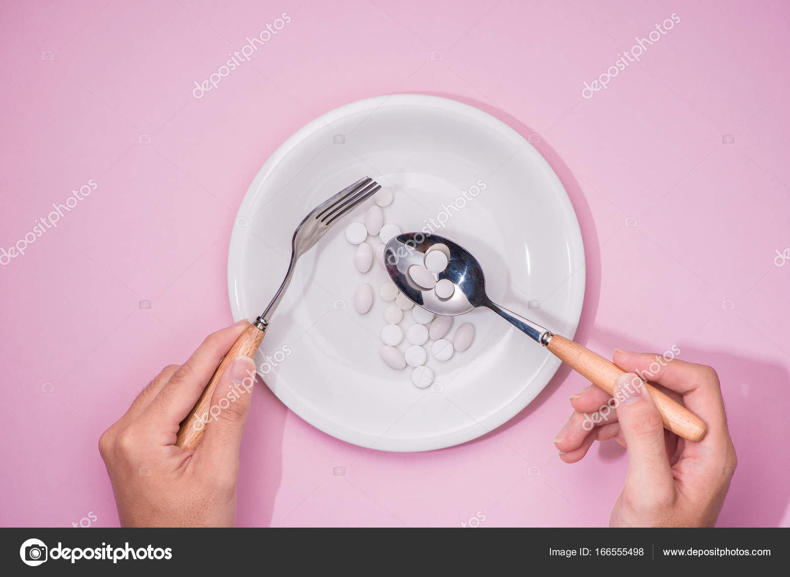 Hands holding fork and spoon Stock Photo by ©makidotvn 166555498