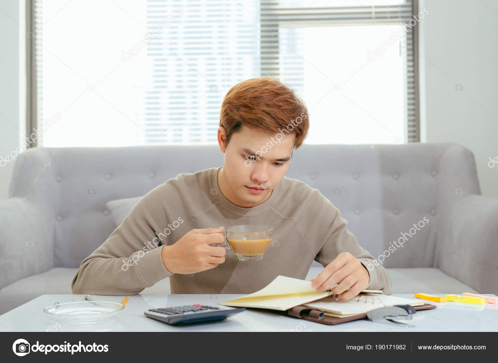 Young Asian Man Sitting Sofa Calculator Accounting Costs Charges Taxes ...