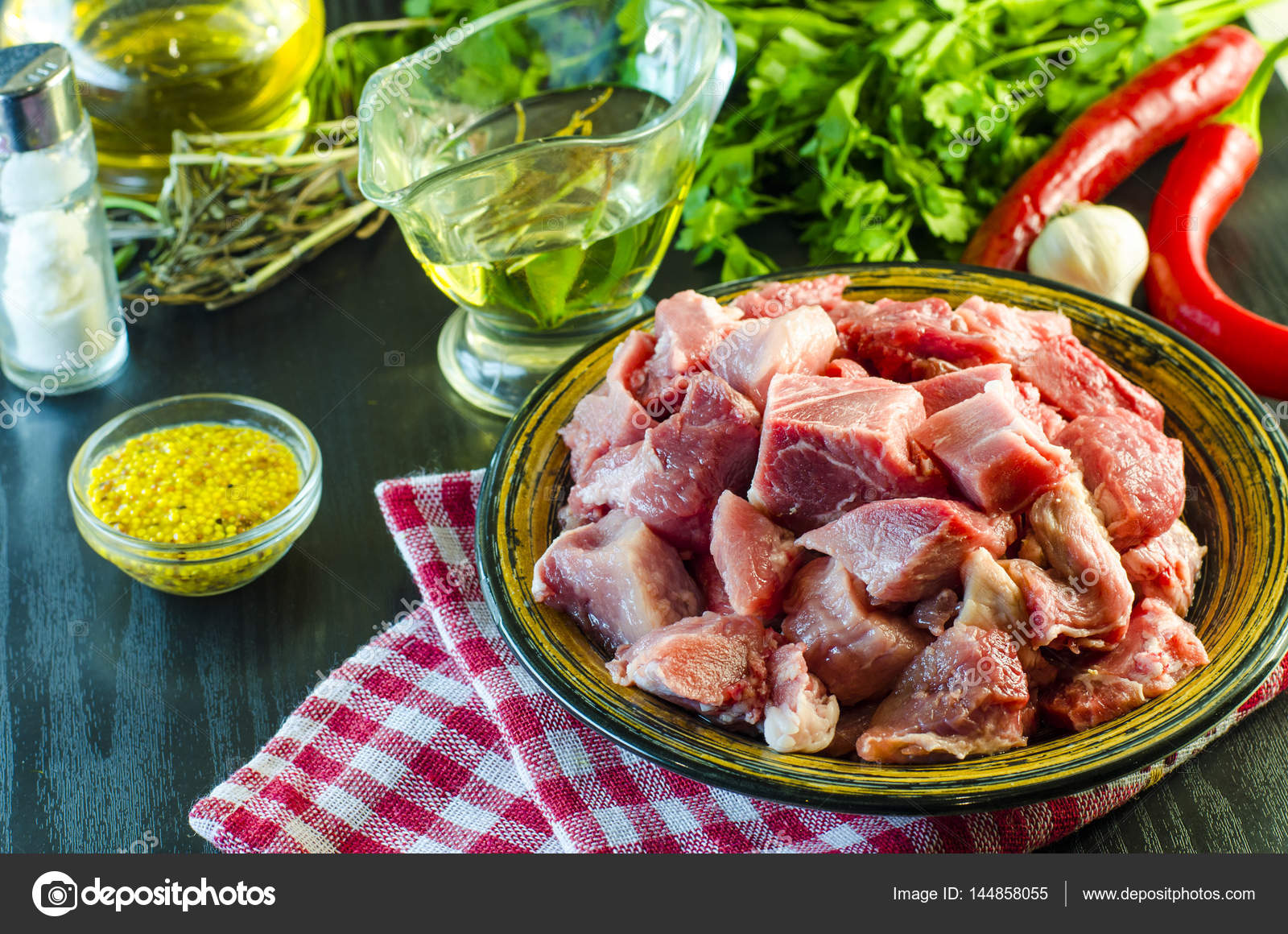 Raw meat chopped into pieces on a plate — Stock Photo © Katerina3 ...