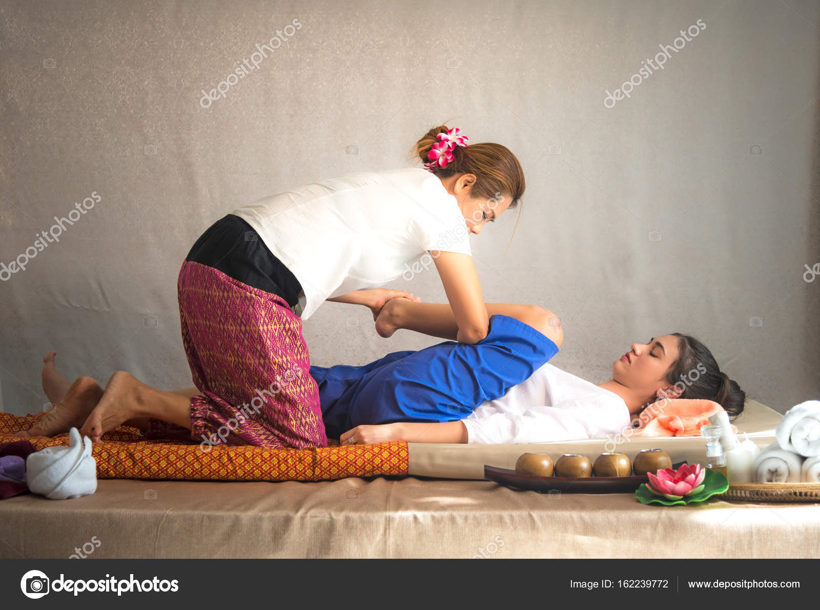 Thai Masseuse Doing Massage For Woman In Spa Salon Asian Beautiful