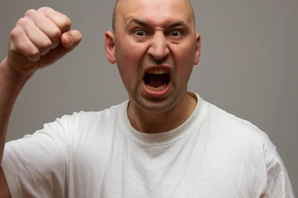 Enraged man with a knife aggressive, frustrated portrait man, holding ...
