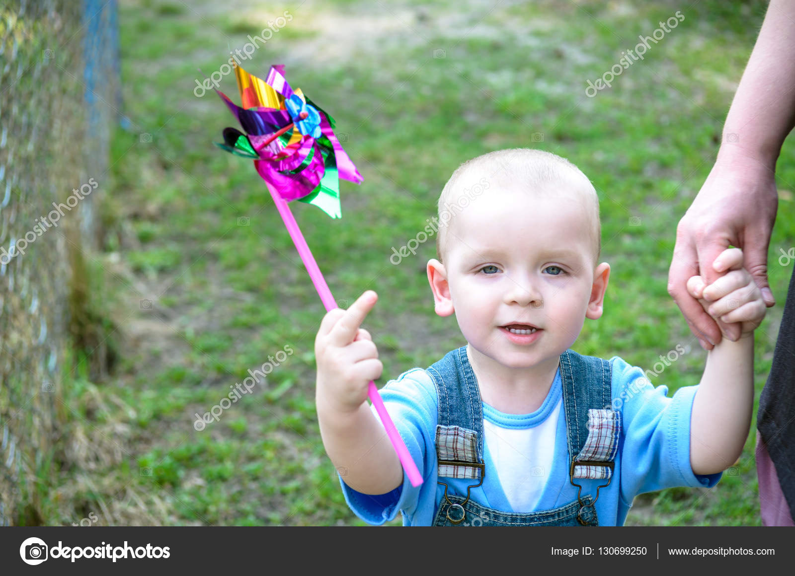 Cute little boy holding windmill show fuck. ⬇ Stock Photo, Image by ... Cute little boy holding windmill show fuck. ⬇ Stock Photo, Image by ...