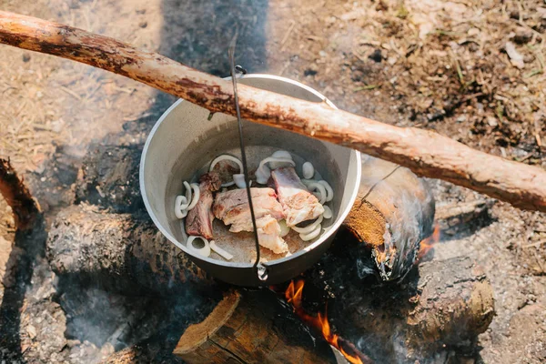 The fire near the camp. Cooking food on a fire. Journey into the wild ...