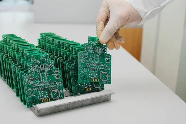 Microchip production factory. Technological process. Assembling the board. Computer expert ...