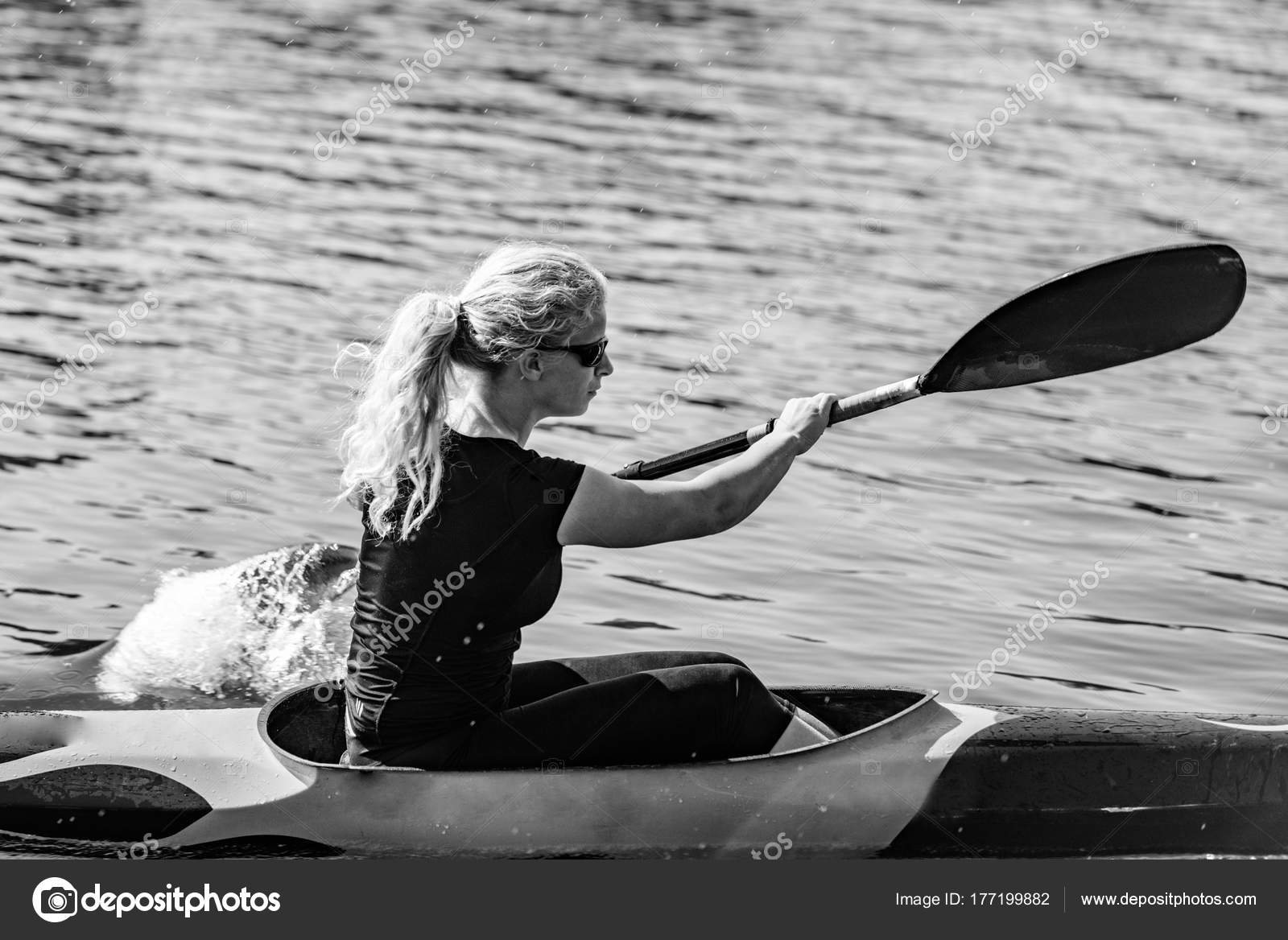 Female Kayaker Training Lake Stock Photo by ©microgen 177199882