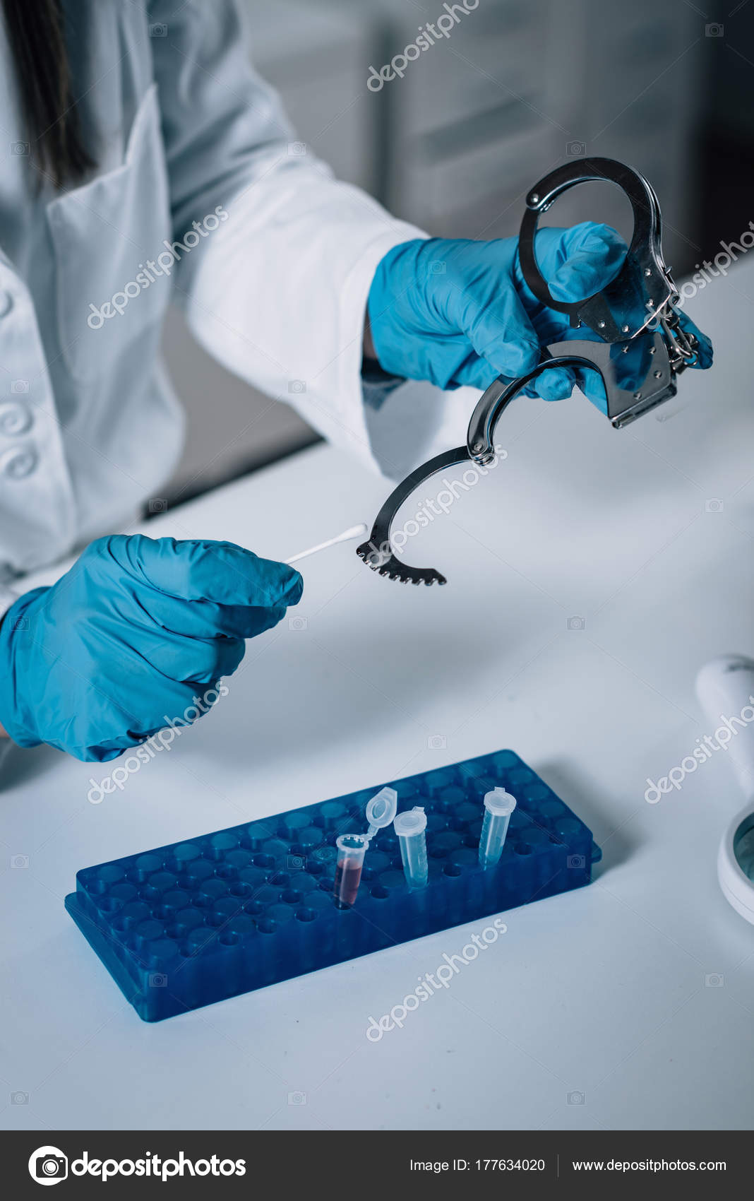 Forensic Science Lab Forensic Scientist Examining Handcuff Evidences ...