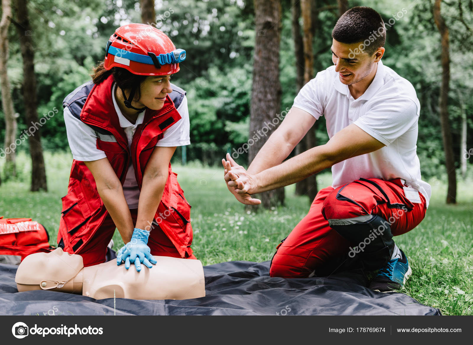 Cpr Practice Woman Man Cpr Dummy Outdoors Stock Photo by ©microgen ...