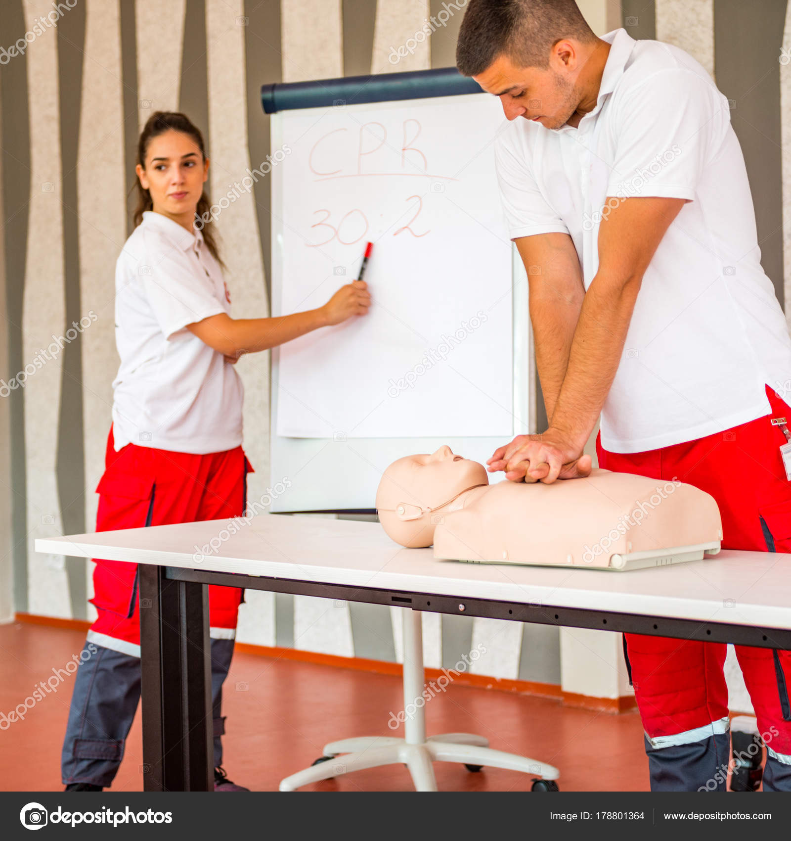 Cpr Class Instructors Talking Demonstrating First Aid Compressions ...