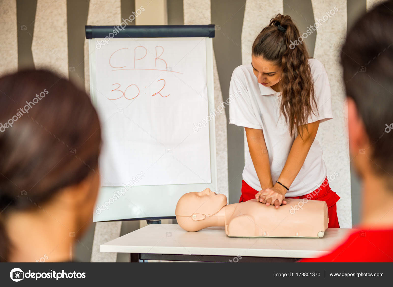 Cpr Class Instructor Talking Demonstrating First Aid Compressions ...