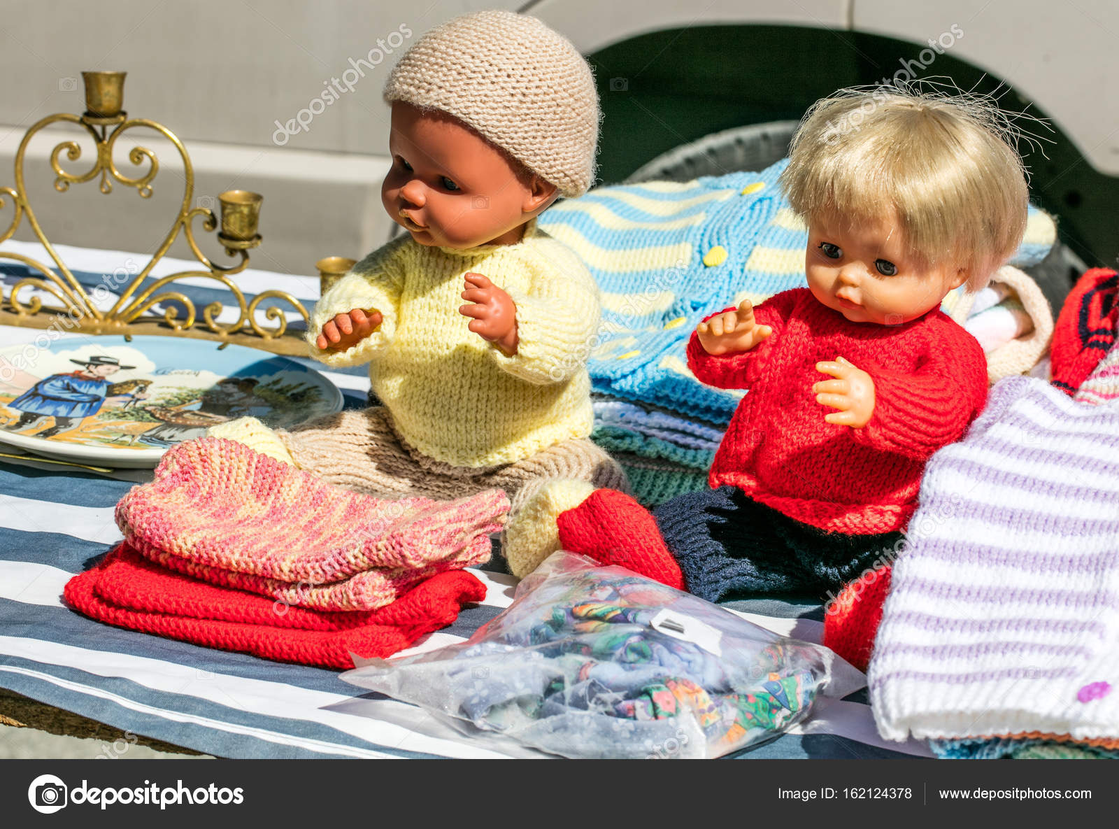 70s second hand plastic dolls for knitting know-how outdoor Stock Photo ...