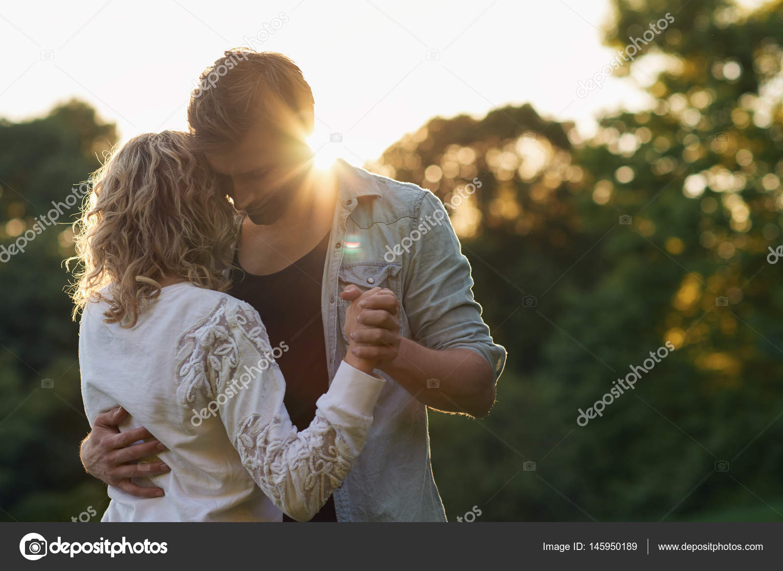 Couple dancing hand in hand — Stock Photo © mavoimages #145950189