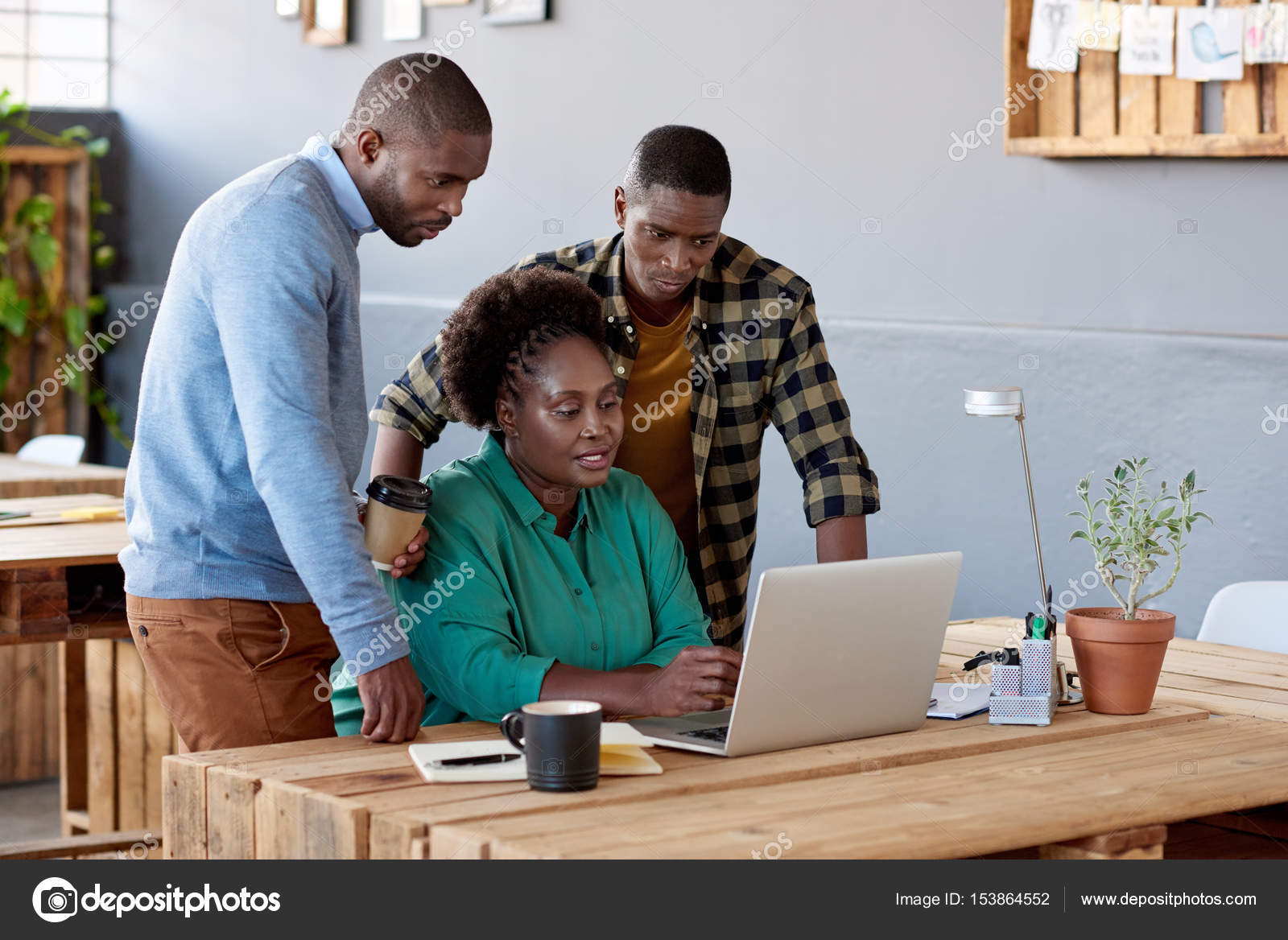 Focused African coworkers — Stock Photo © mavoimages #153864552 Focused African coworkers — Stock Photo © mavoimages #153864552