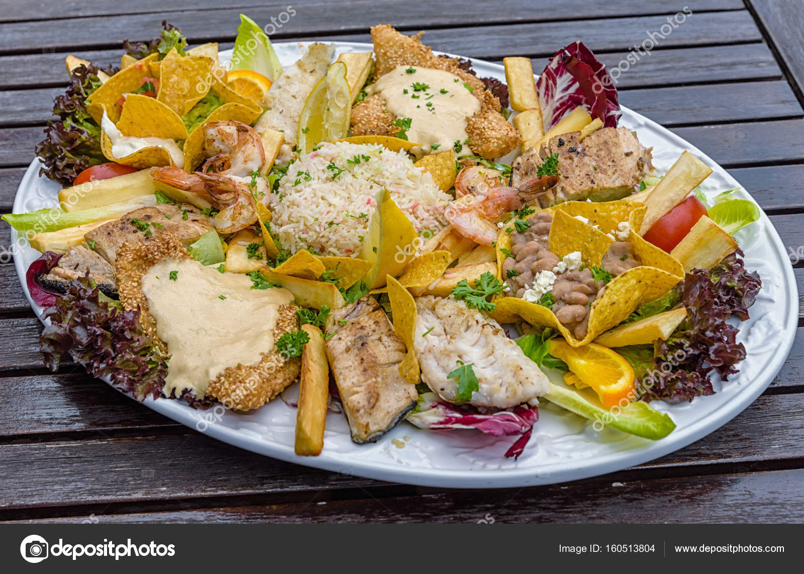 Seafood platter Plato pescado mixto. Different kinds of fish, sauce ...