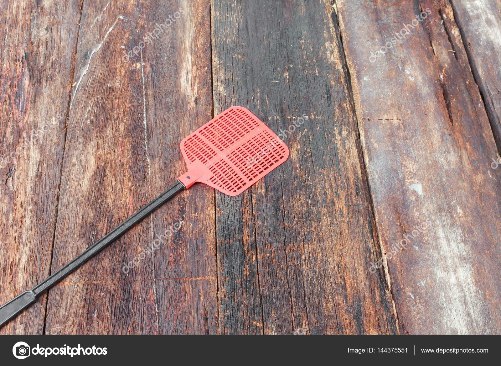 Red fly swatter. Single flyswatter made of plastic and unfailing ...