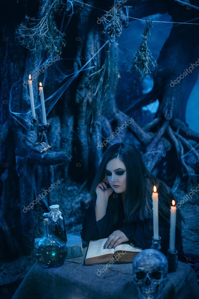 Attractive witch doing magic in the magic lair. Stock Photo by ...