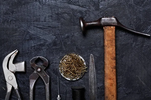 Set of cobbler vintage tools on the wooden background. Top view Stock ...