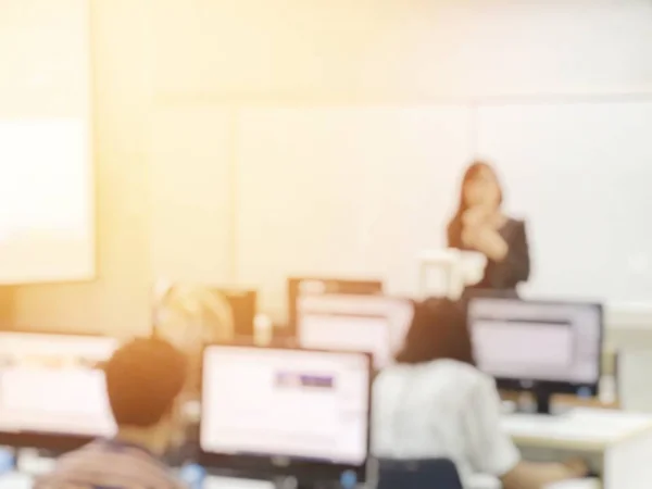 Blurred image of learning group of students in classroom. Study and ...