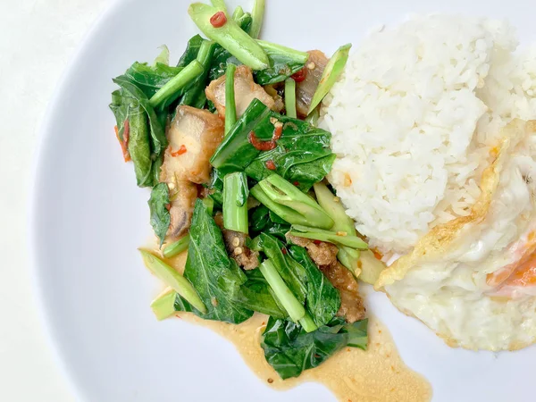 Stir fry Kai Land and crispy pork, stir fried rice with rice in white ...