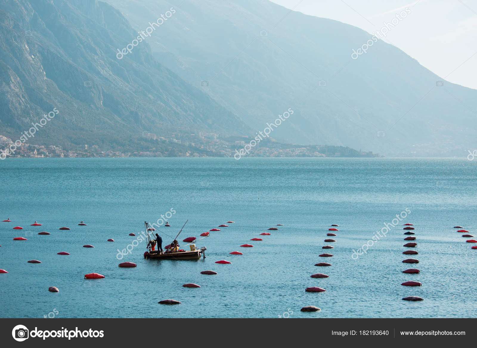 Two workers of mussel and fish farm — Stock Photo © Scharfsinn #182193640