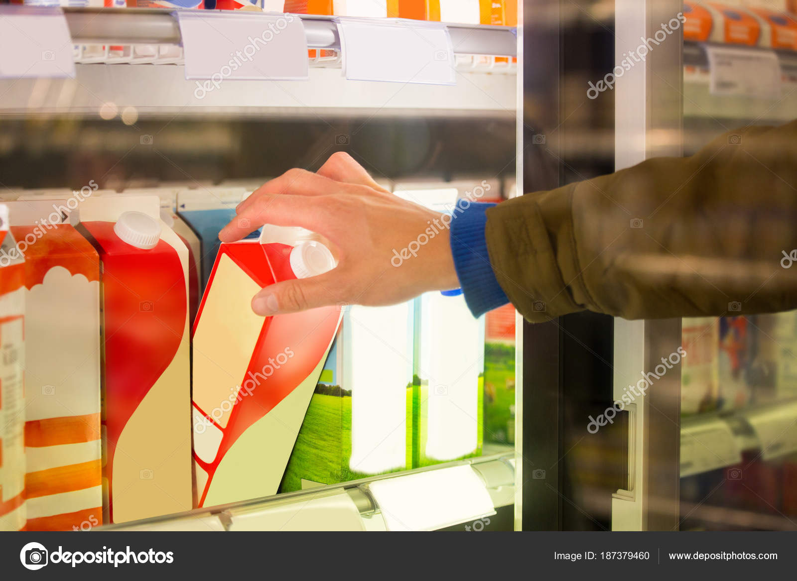 Customer chooses the milk Stock Photo by ©Scharfsinn 187379460