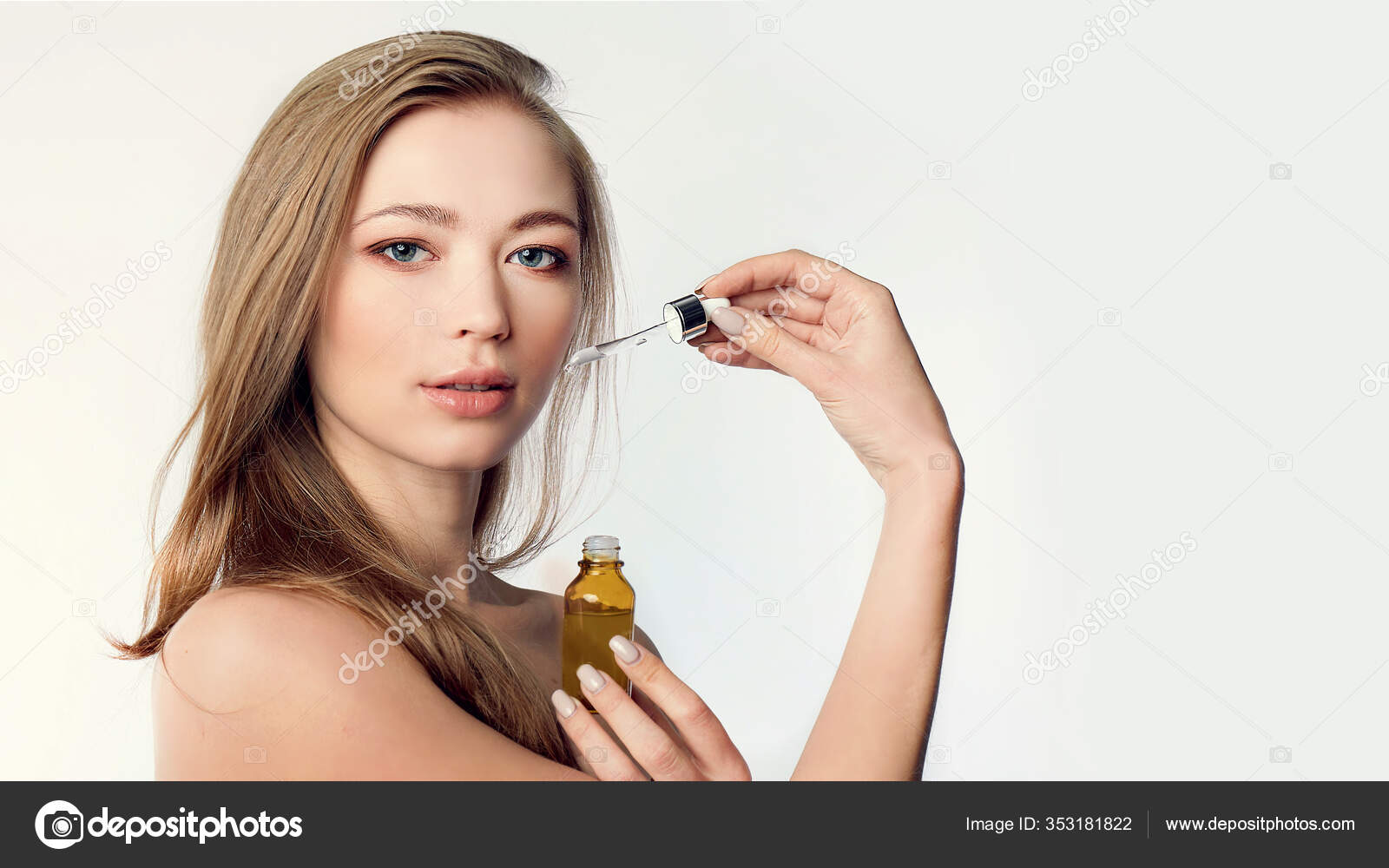 Beautiful model applying a skin serum treatment on white. Spa, skincare ...