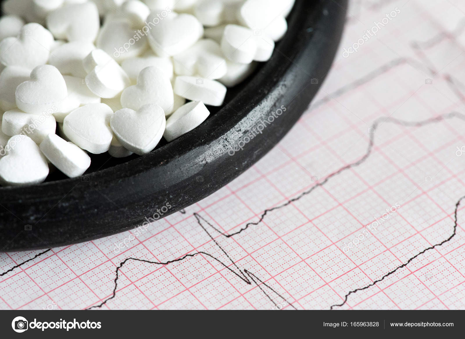 Cardiology. Macro of ECG graph and cardio pills. Pills as a hear Stock ...