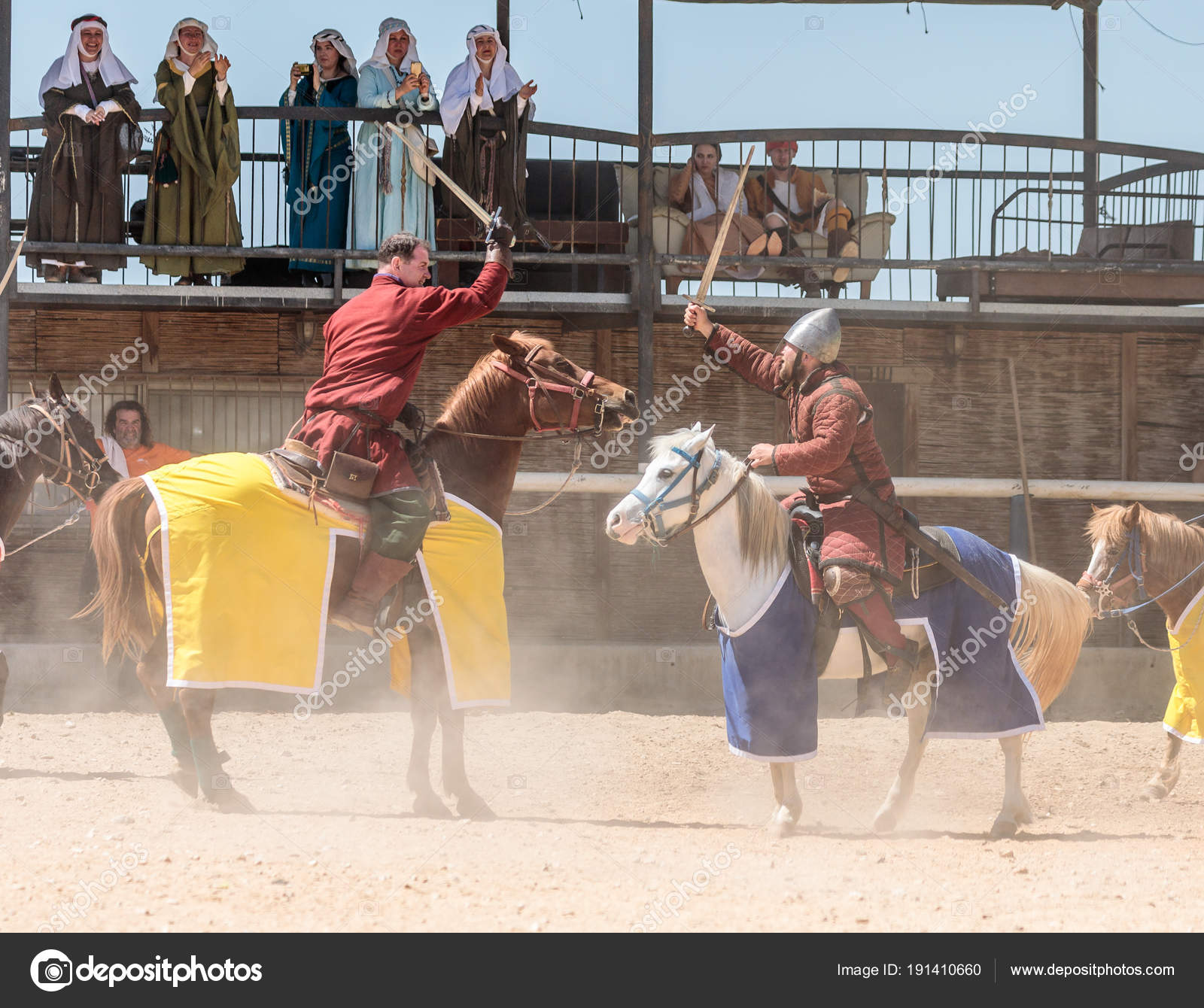 A mounted warriors show demonstration fight on swords at knight ...