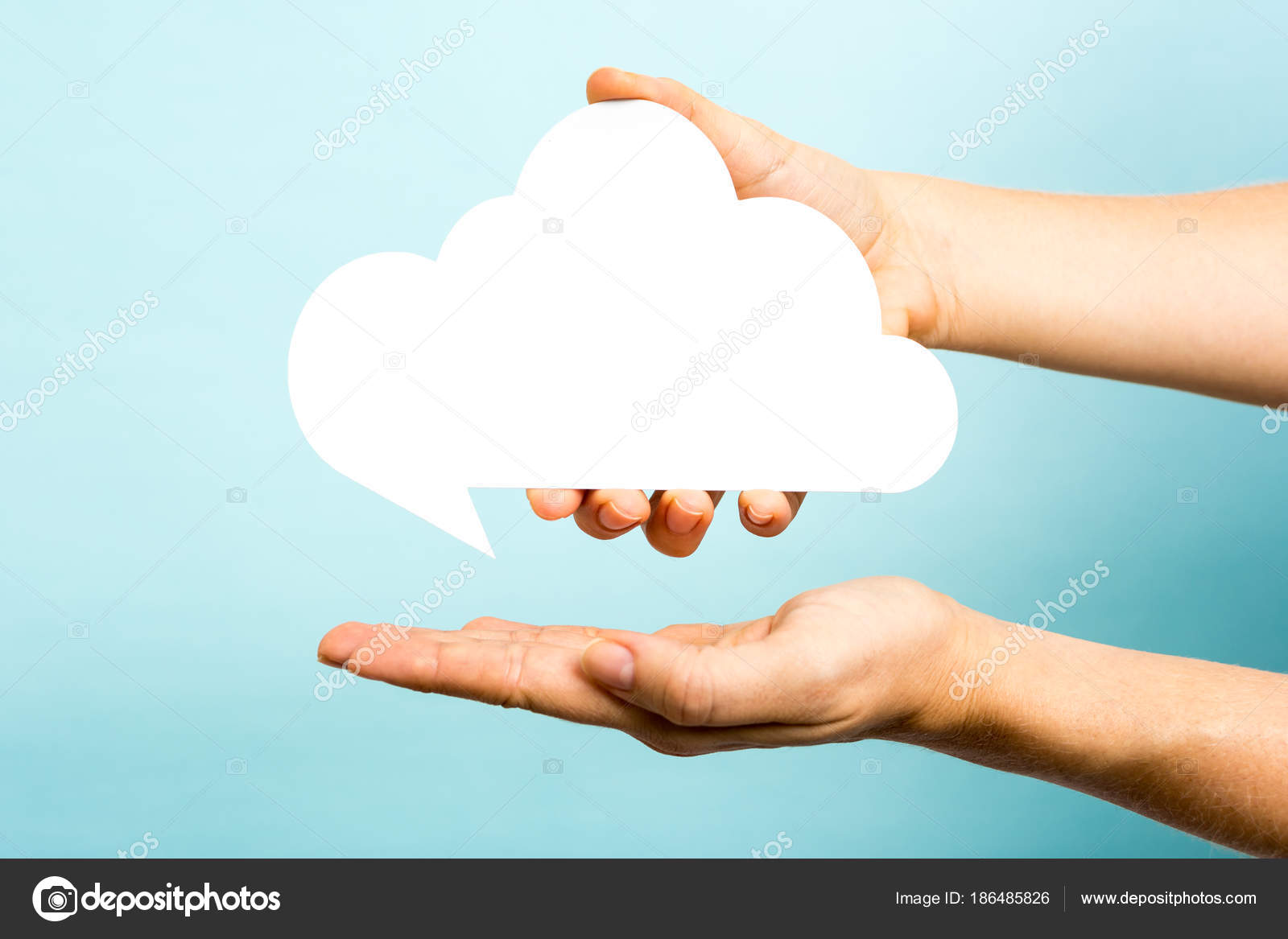 One hand showing a white cloud on blue background. Internet concept ...