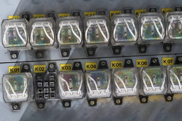 Row of white Relay actuators with yellow marks — Stock Photo ...