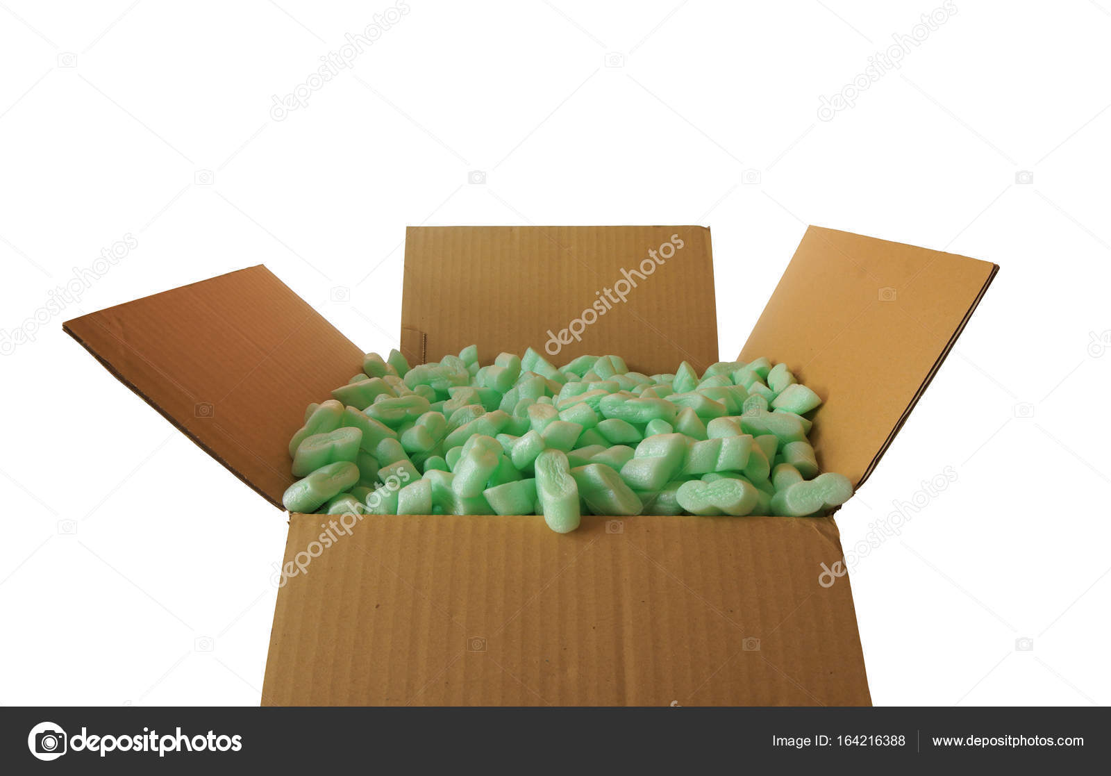 Front view of corrugated cardboard box full of pieces of green plastic ...