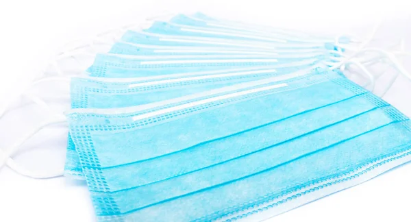 batch of disposable medical personal protective masks - used in COVID ...