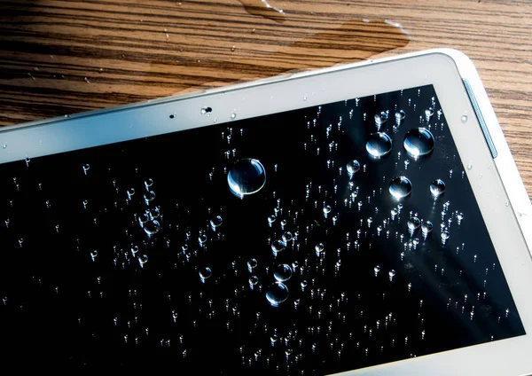 Drops of water on tablet screen - Stock Image - Everypixel