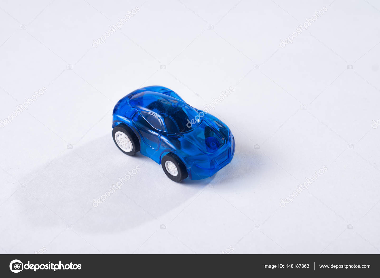 Plastic blue Toy car on white background, simple design, childrens toy ...