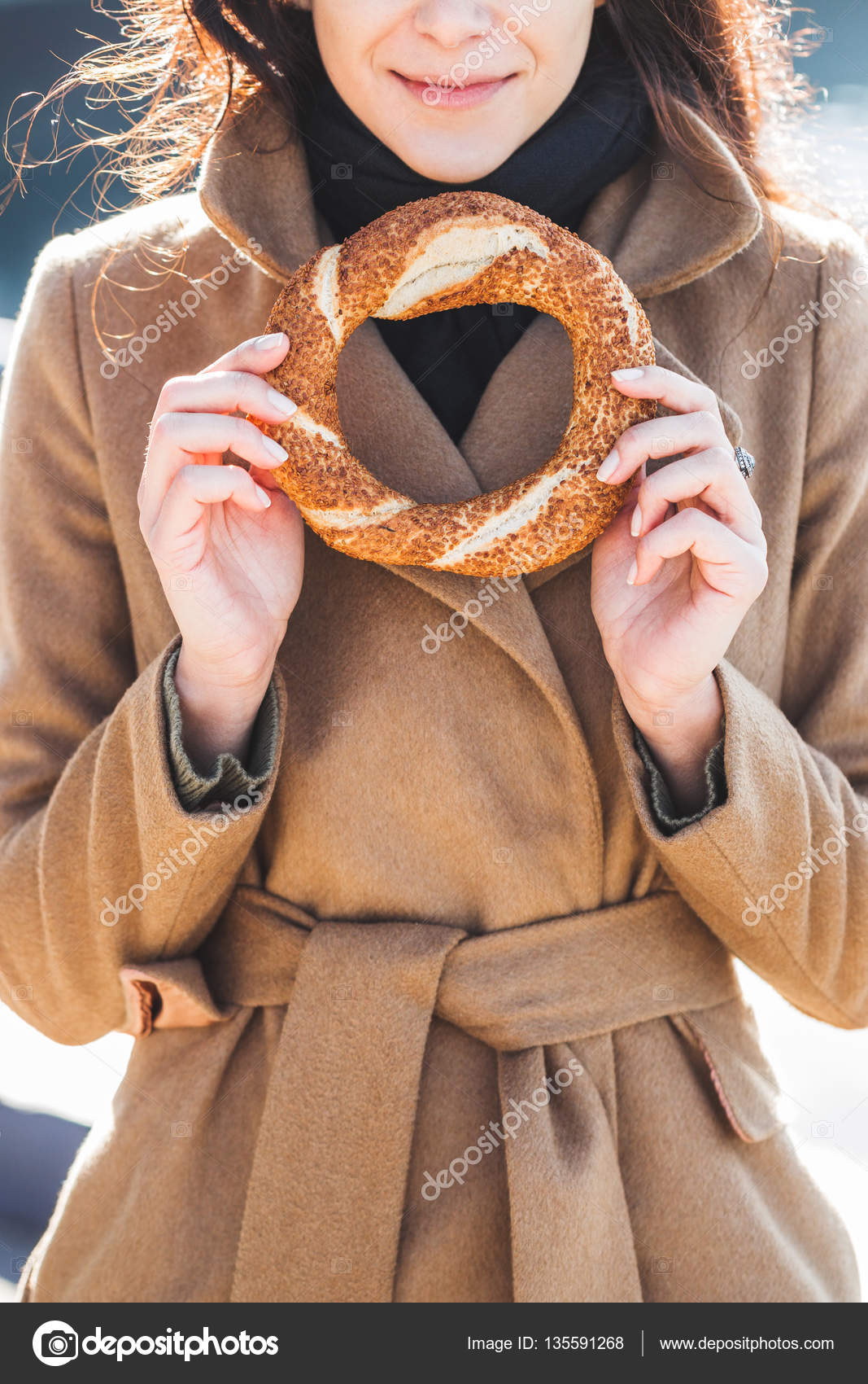 Woman holds Turkish simit — Stock Photo © olegbreslavtsev #135591268