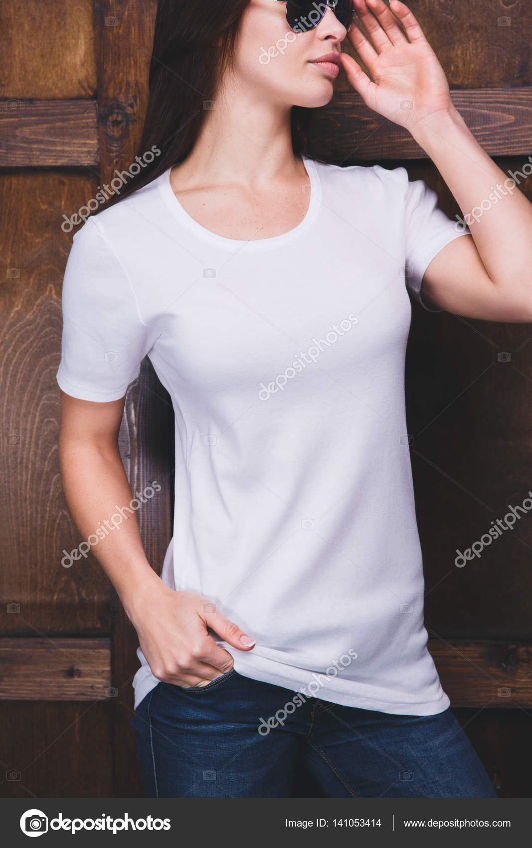 Woman wearing white t-shirt in front of wooden wall Stock Photo by ... Woman wearing white t-shirt in front of wooden wall Stock Photo by ...