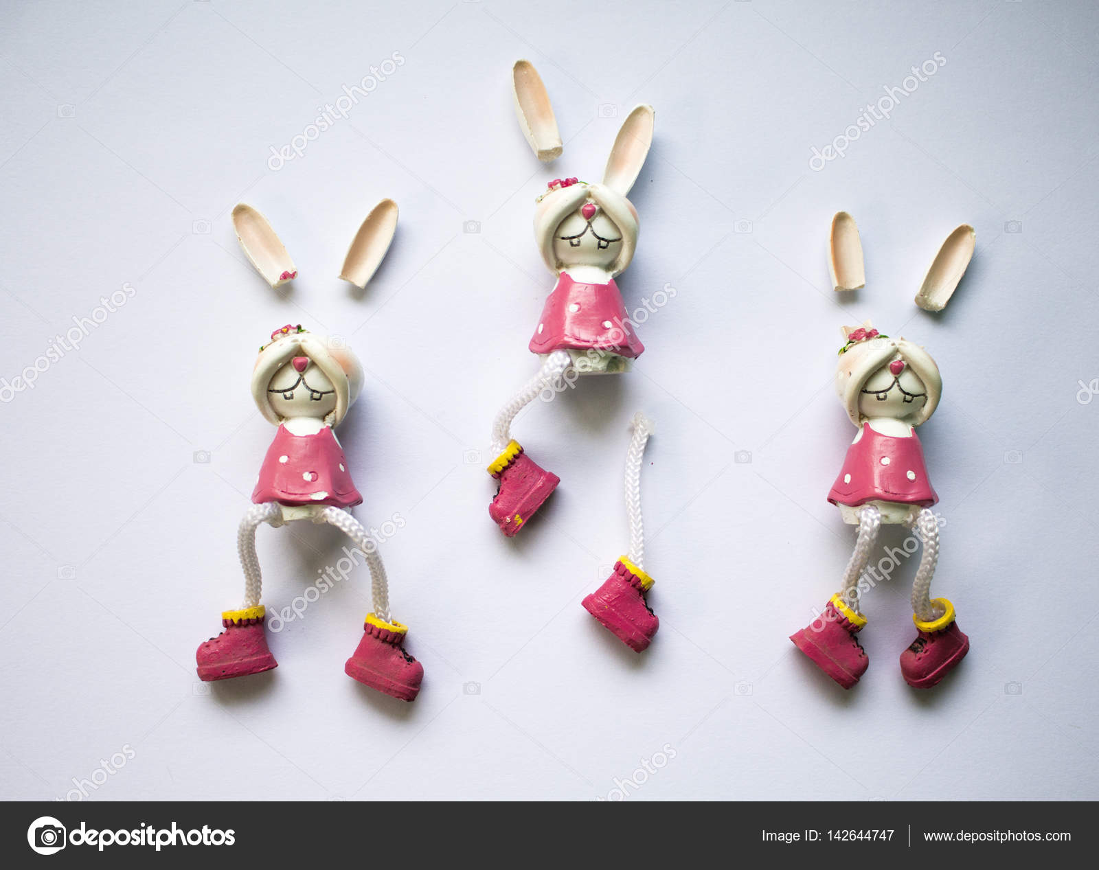 Broken toys on white background. Flat image of broken rabbit with ...