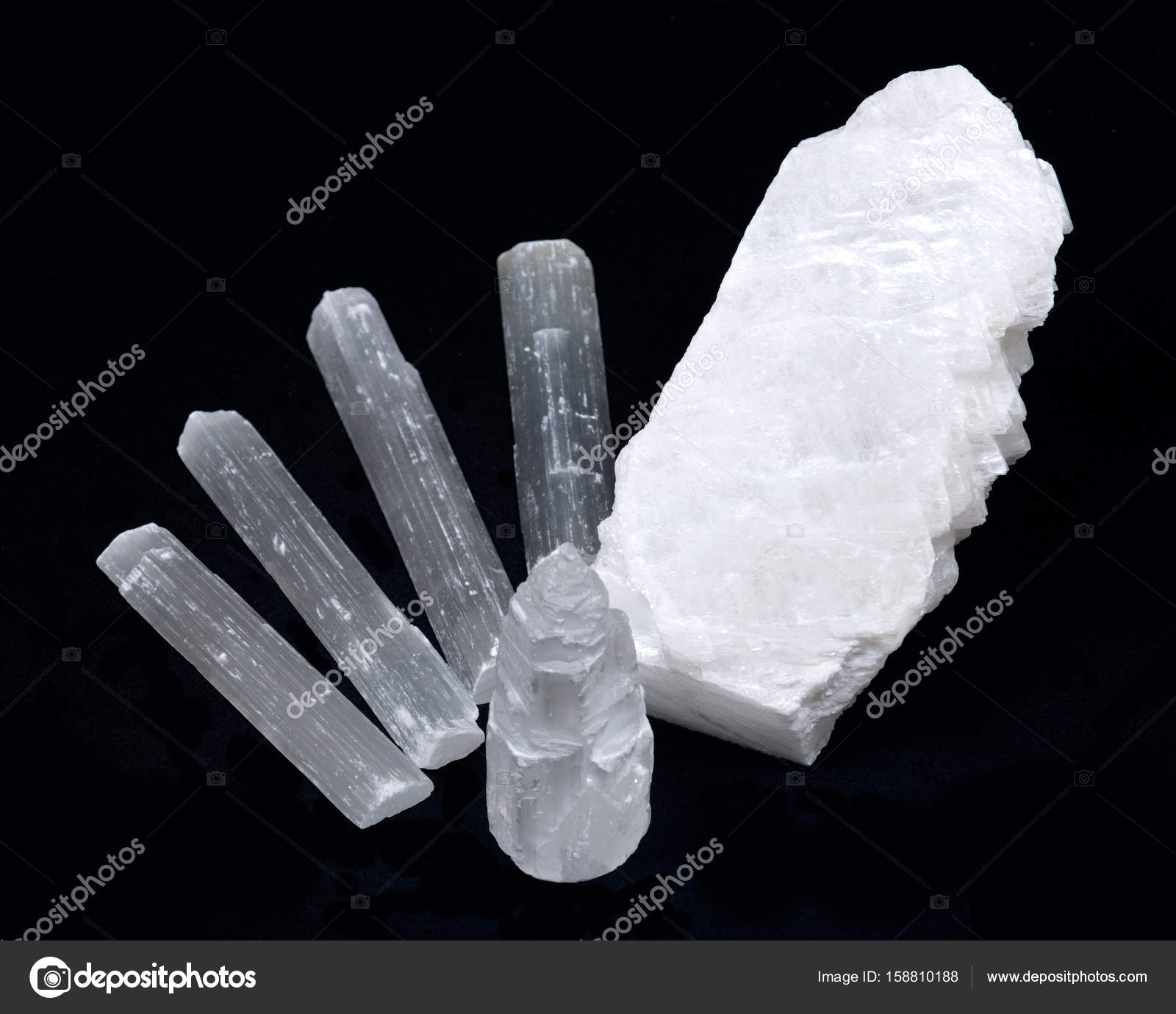 White mexican fish tail selenite with natural selenite rods Stock Photo ...