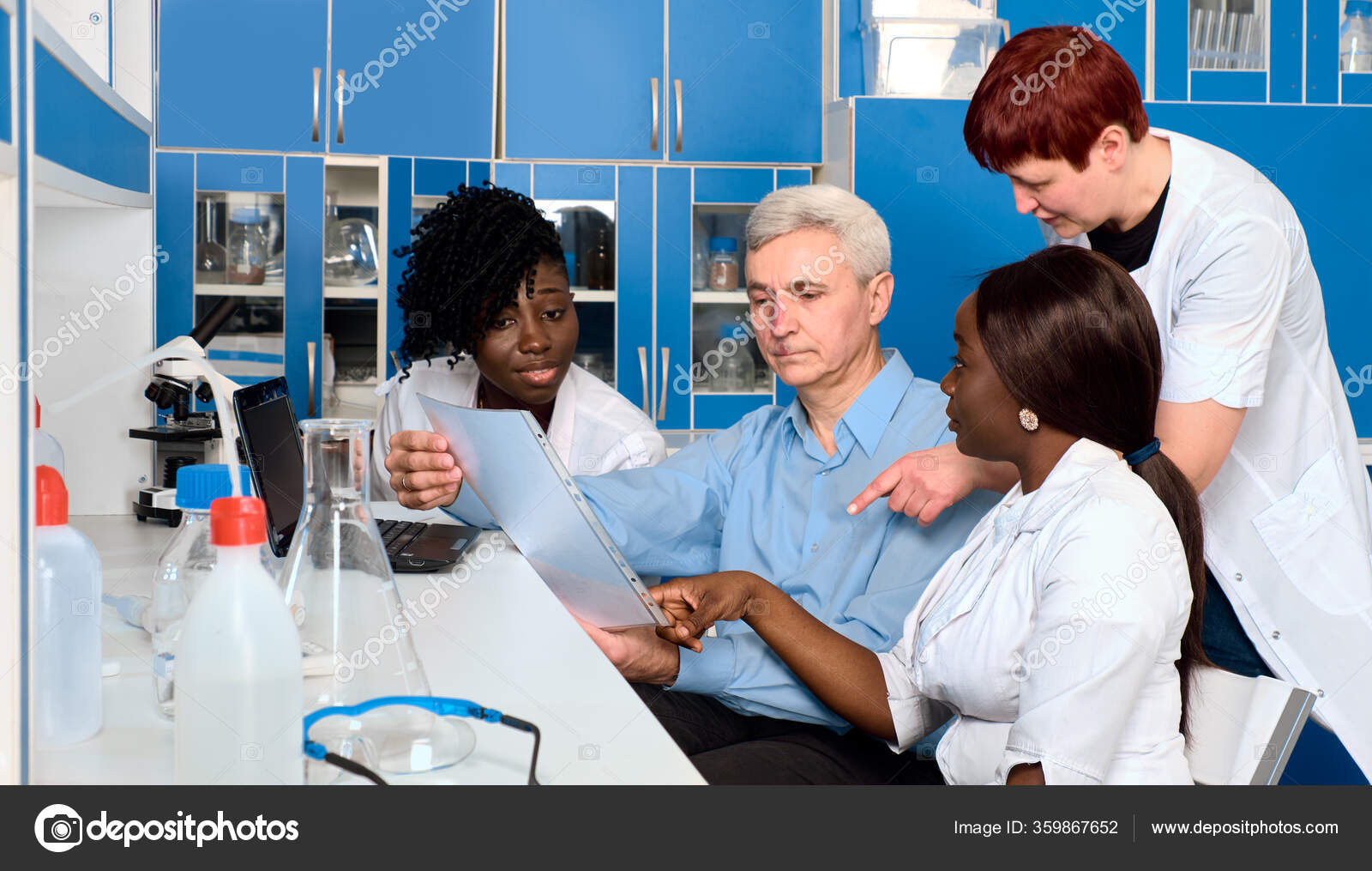 Caucasian Senior Colleagues Junior African Lab Members Work ...