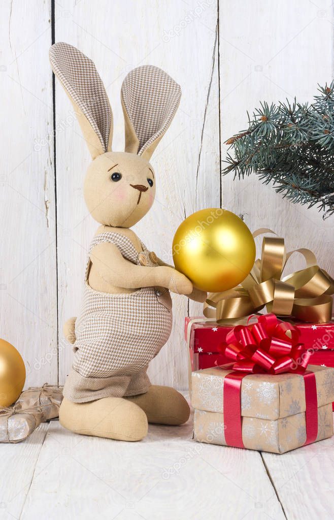 Toy rabbit and gift boxes — Stock Photo © 7511819.bk.ru #129823344