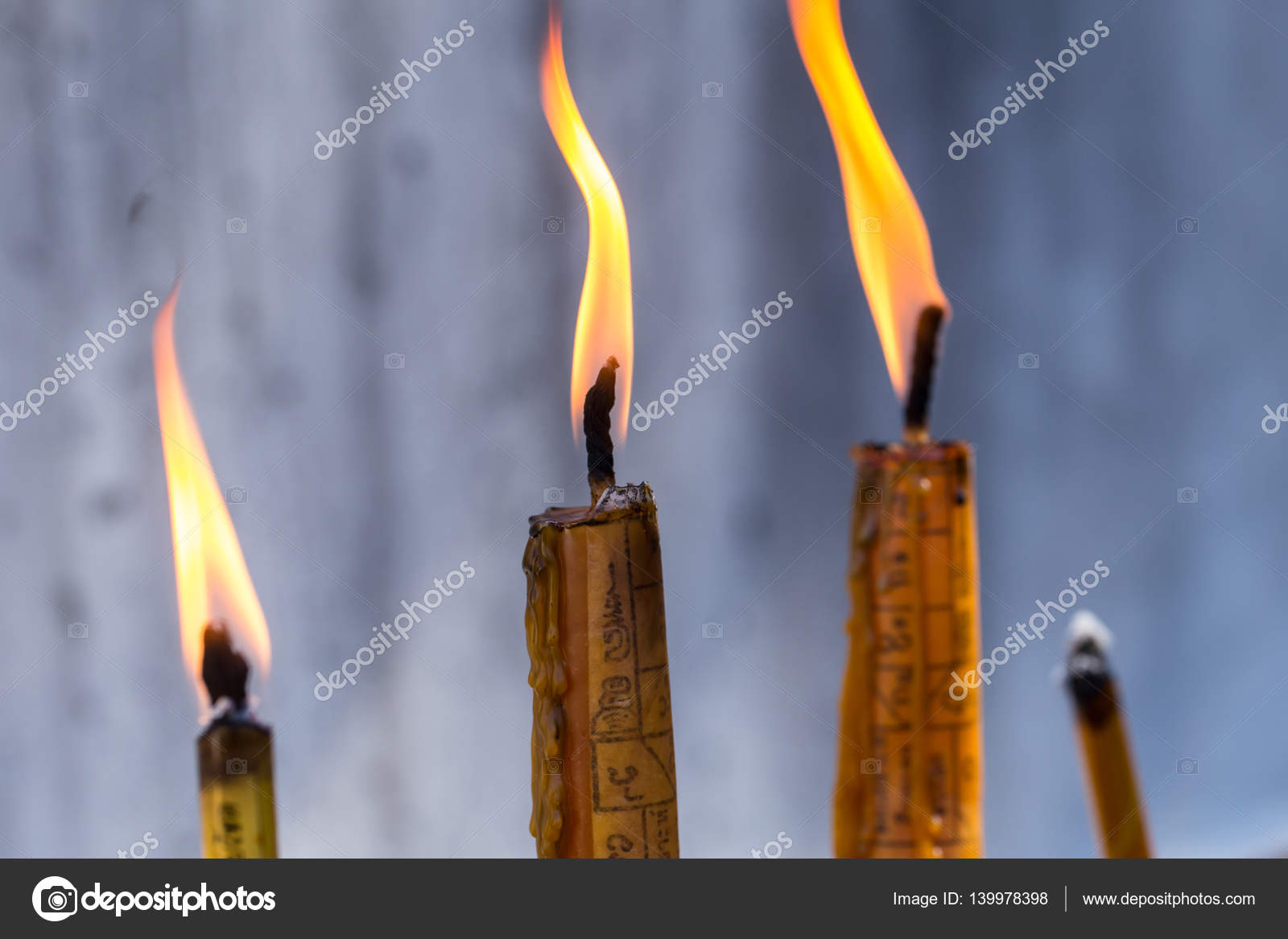 Fire of peace, Buddhist pray and respect Buddha with candle in Thailand ...